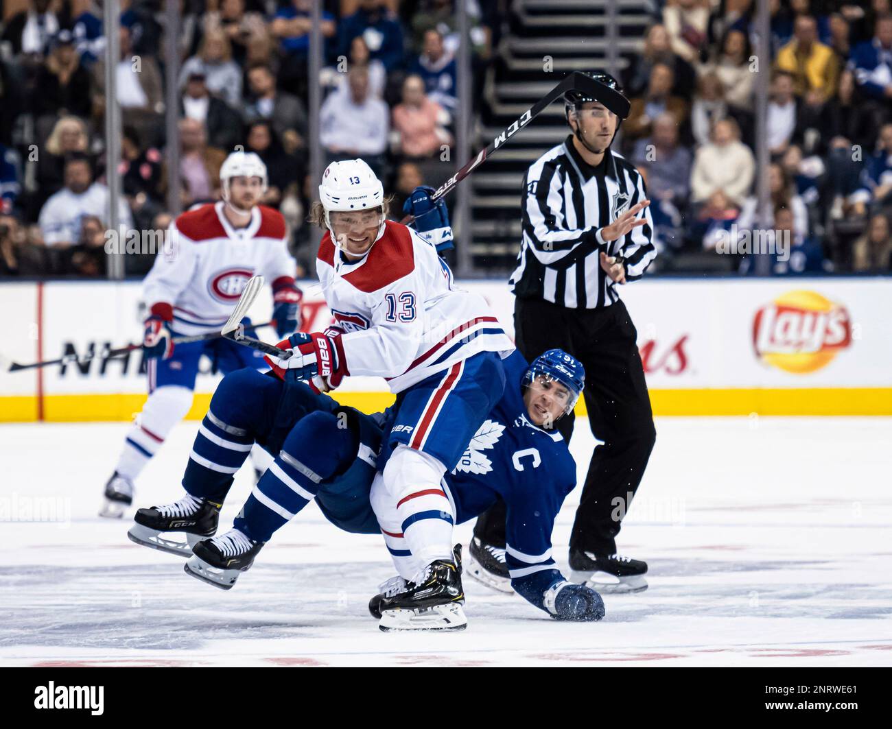 Montreal Canadiens center Max Domi (13) checks Toronto Maple Leafs ...
