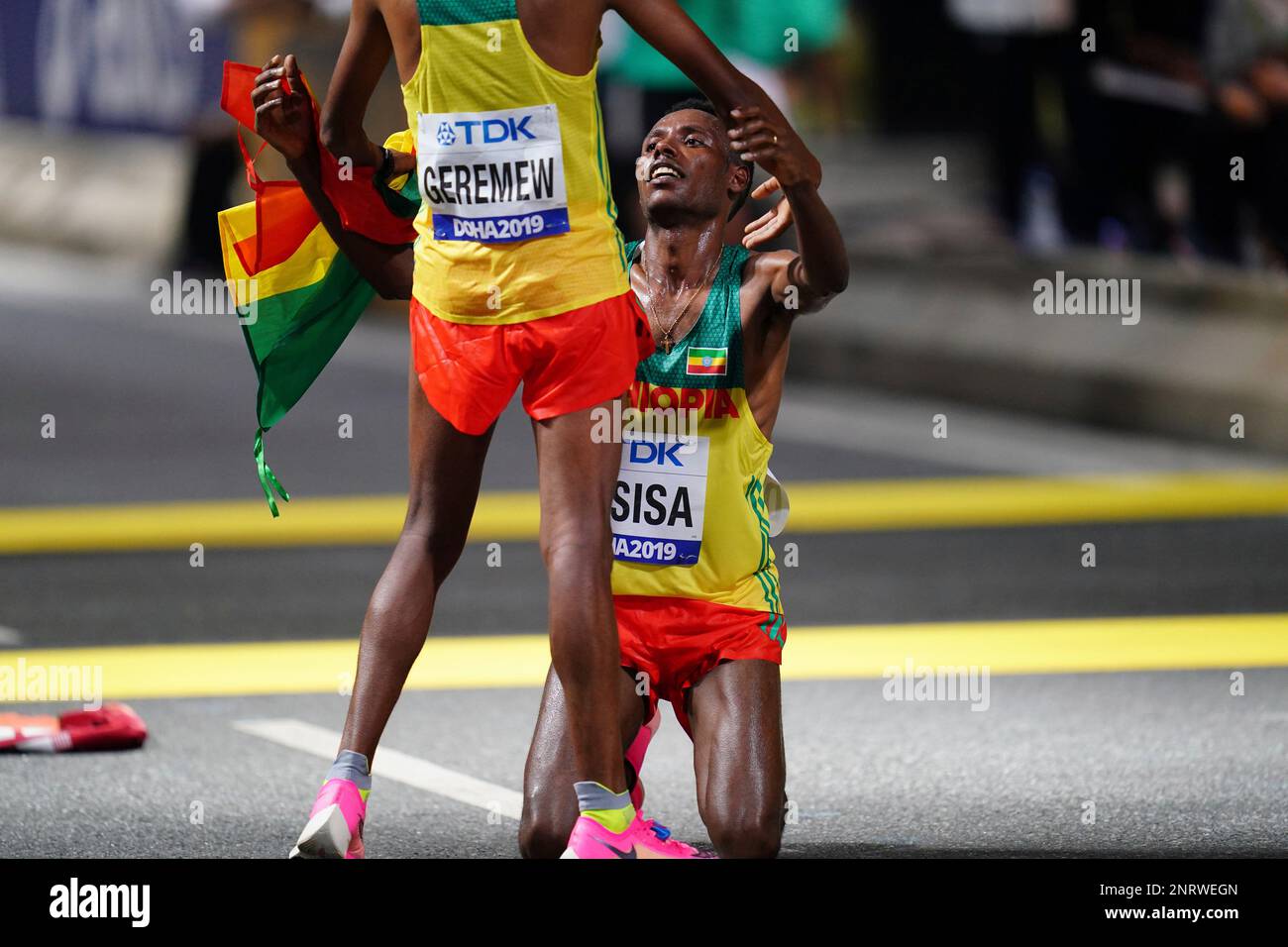 Ethiopia's Lelisa DESISA (R) and Mosinet GEREMEW celebrate after the ...