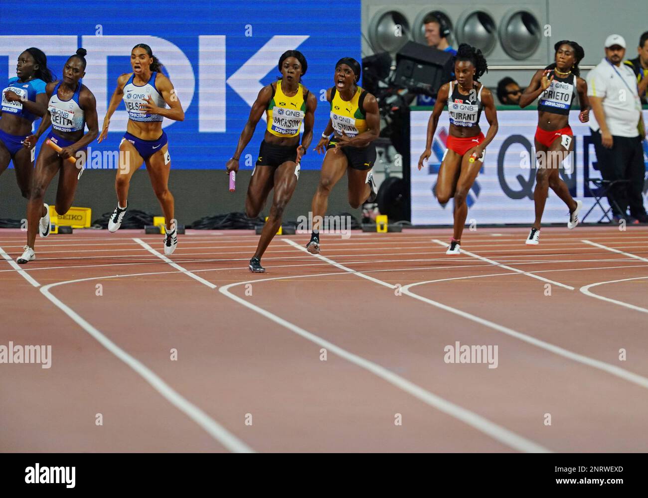 Jamaica's Shericka JACKSON and other 4th runners compete during 4X100 ...