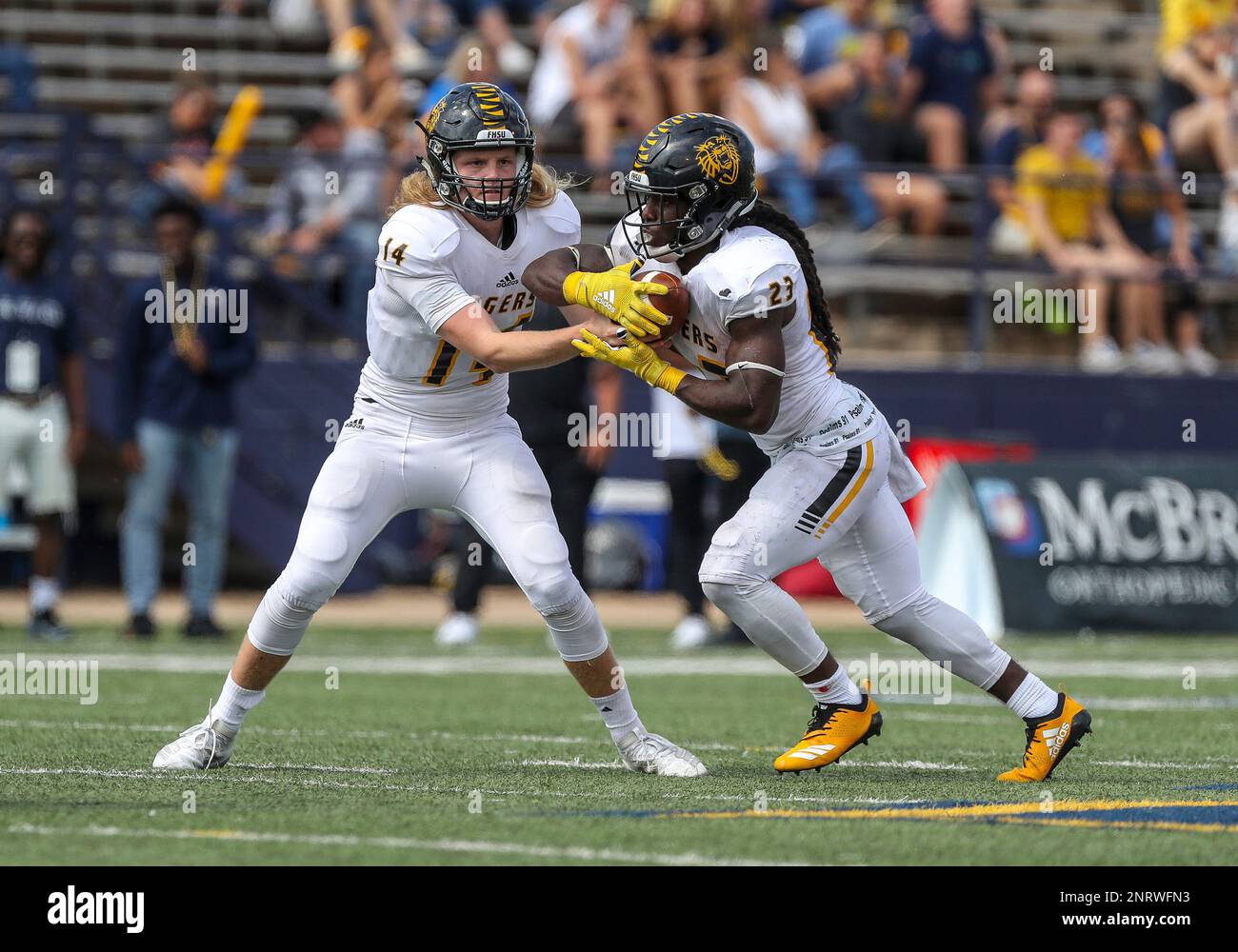 October 05, 2019: Fort Hays State quarterback Chance Fuller (14) hands ...