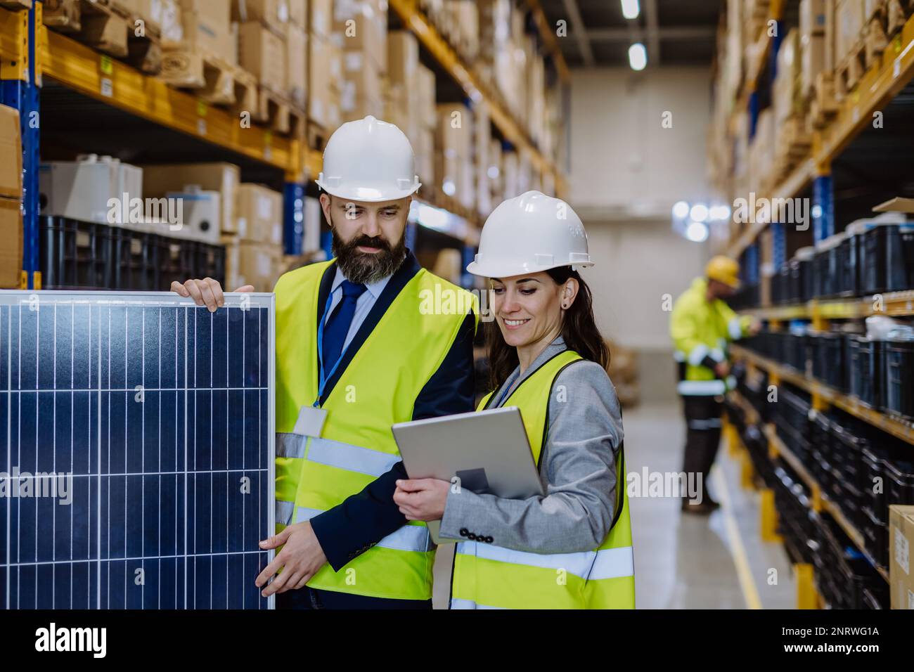 Warehouse workers checking stuff in warehouse with digital system in ...