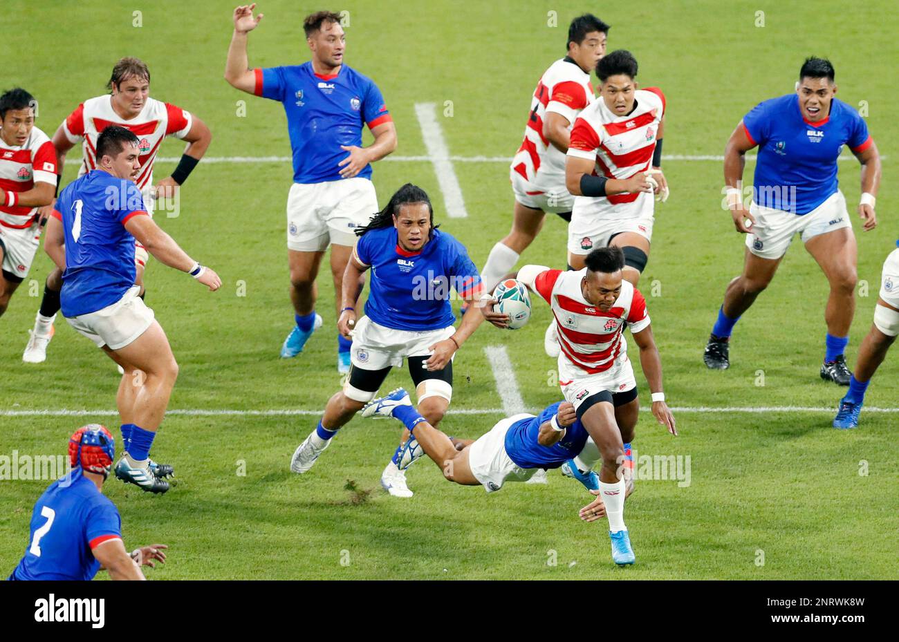 Japan's Kotaro Matsushima runs through the Samoan defence during the ...