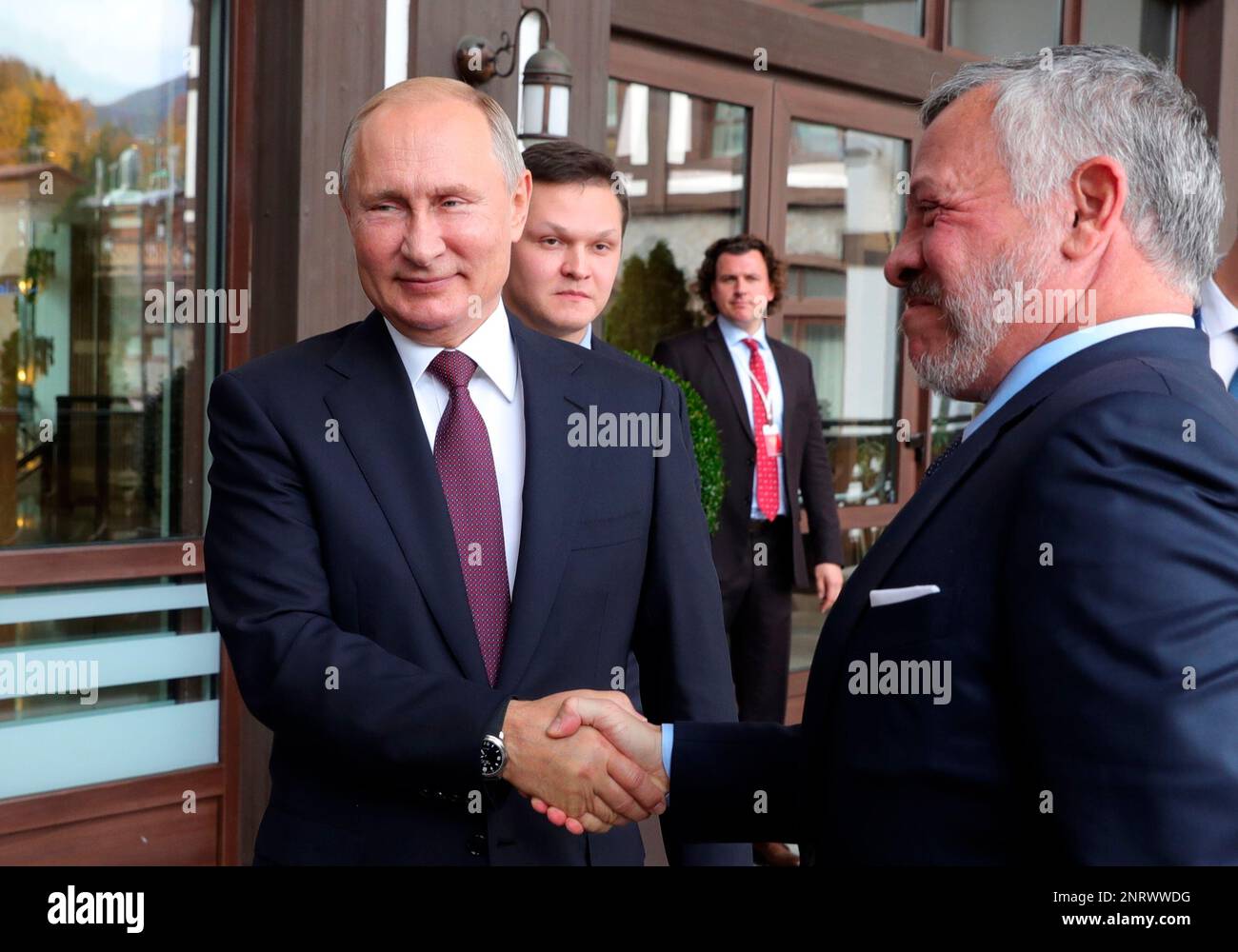Russian President Vladimir Putin, left, shakes hands with Jordan's King ...