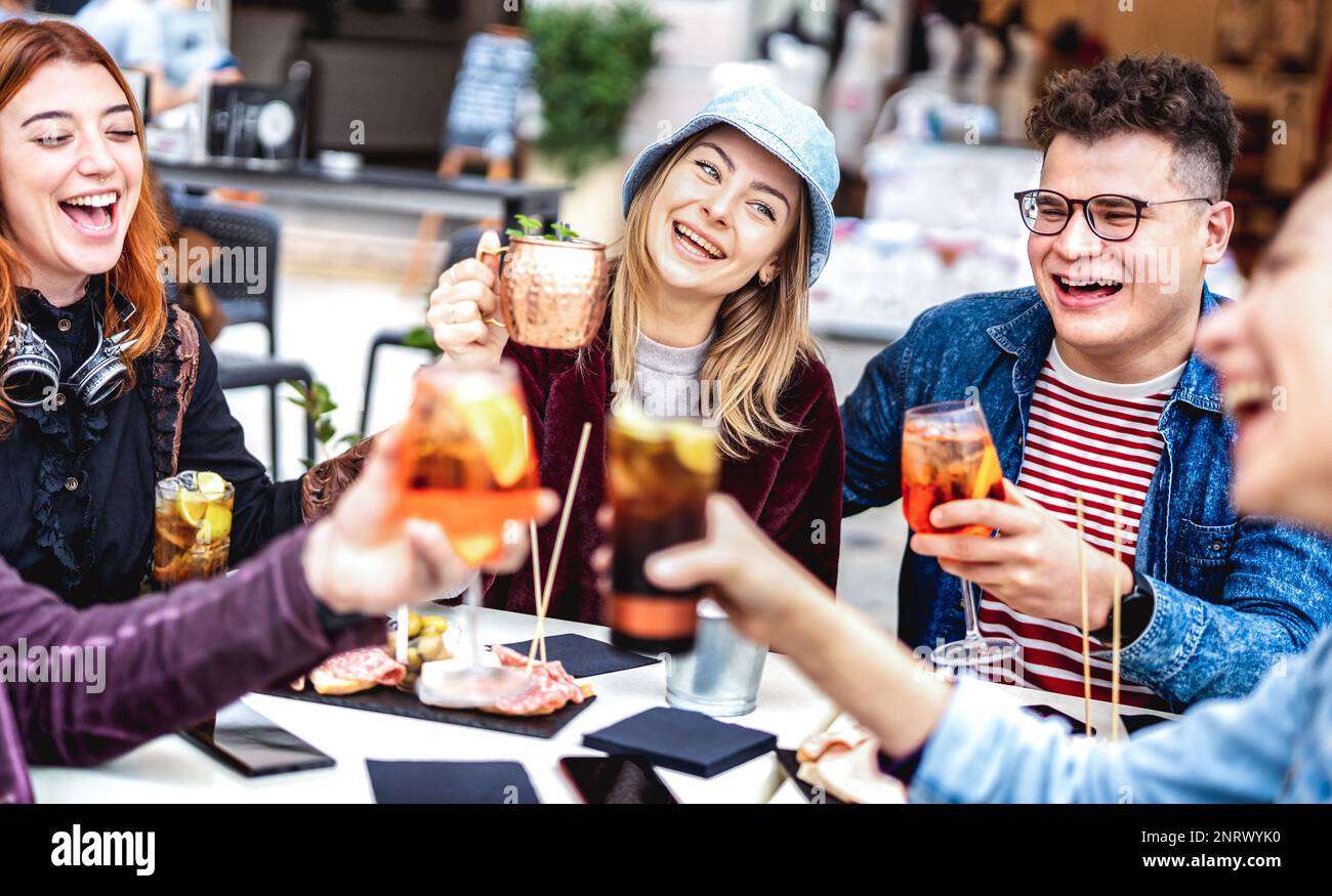 Trendy friends toasting drinks at fancy restaurant out side - Life ...