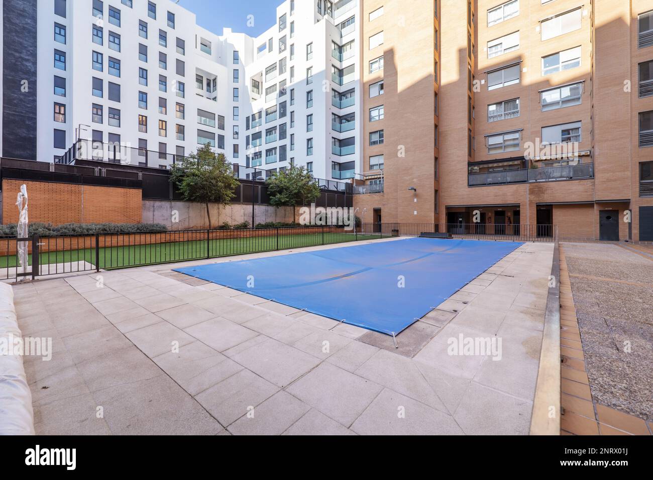 A summer pool covered with canvas to spend the winter in the common ...