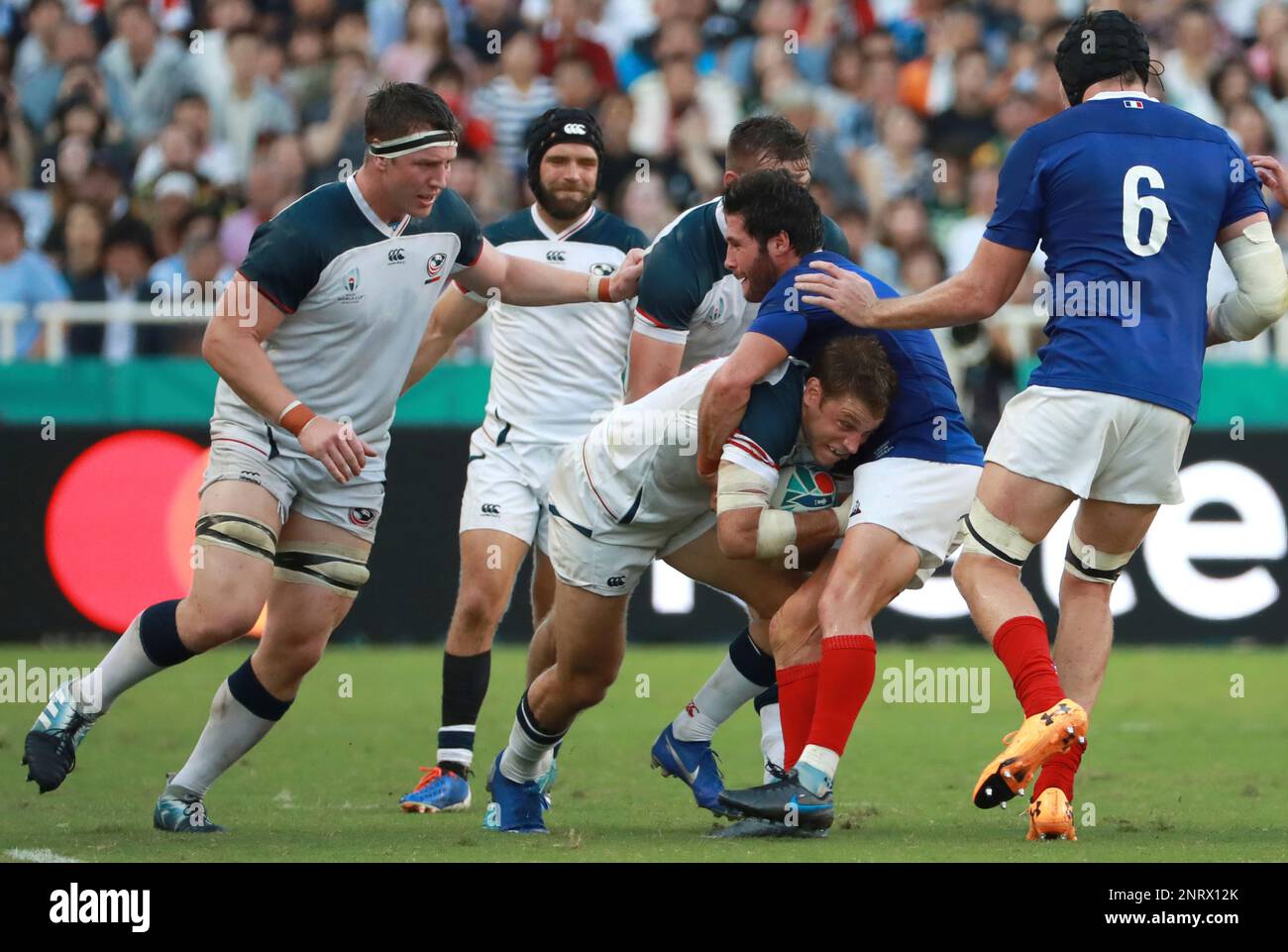 Blaine Scully (C) of U.S.A. squeezes forward during the match against ...