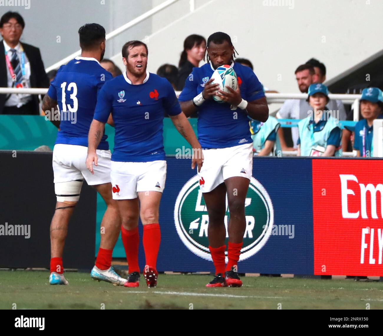 France's Raka Alivereti (R) kisses a ball after scoring a try during ...