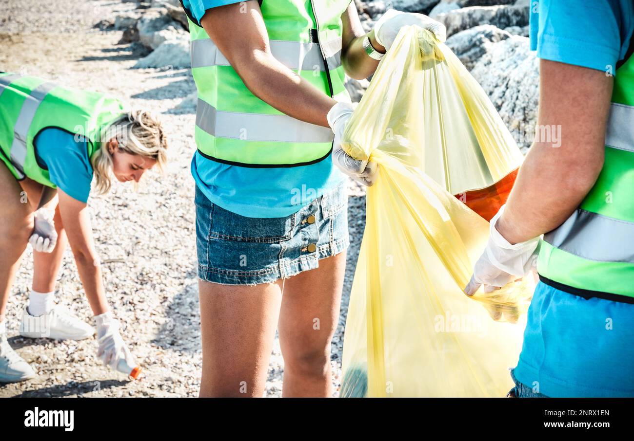 Close up of organized volunteers wearing uniform at beach shore ...