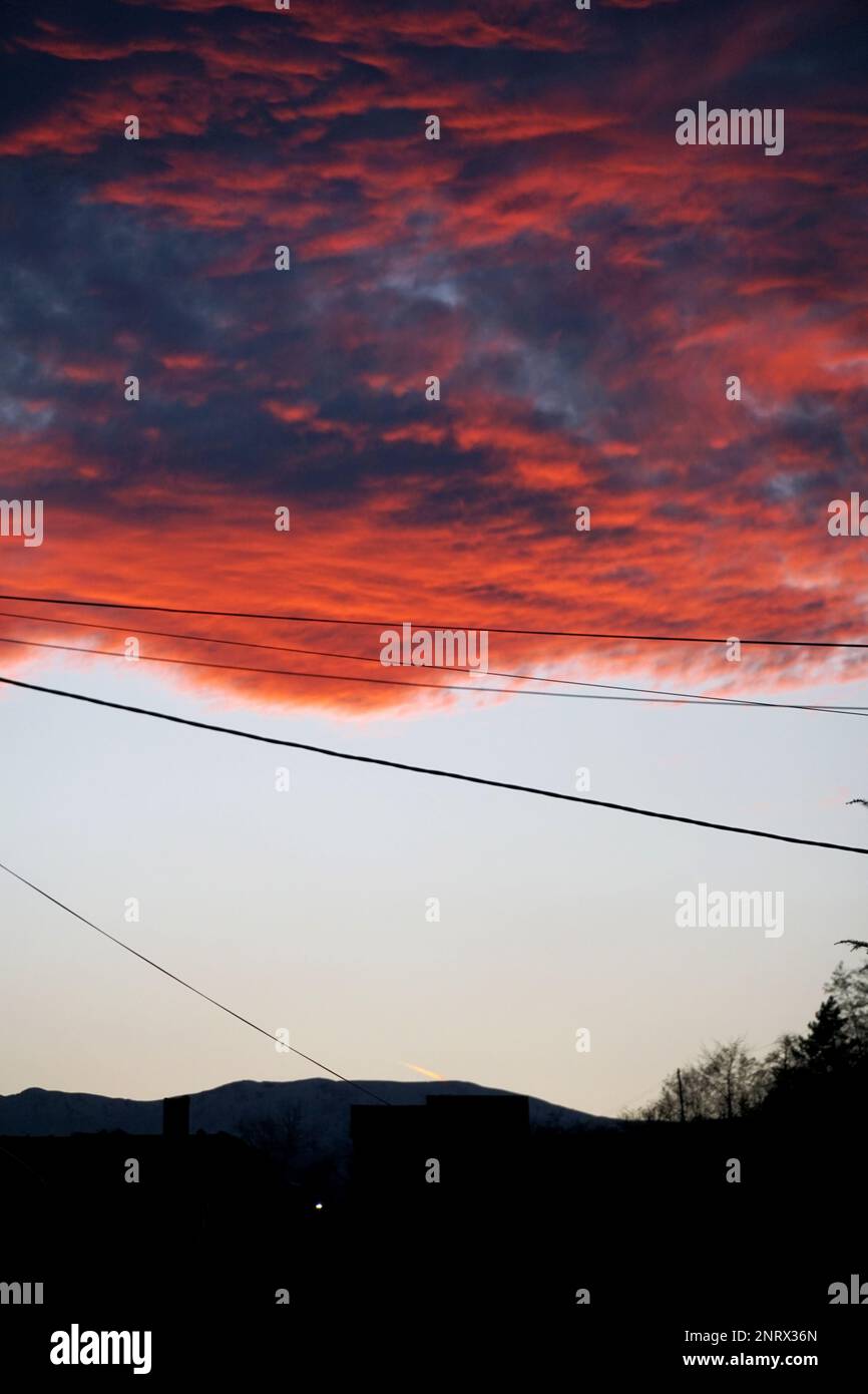 Sunset landscape with dark red clouds Stock Photo - Alamy