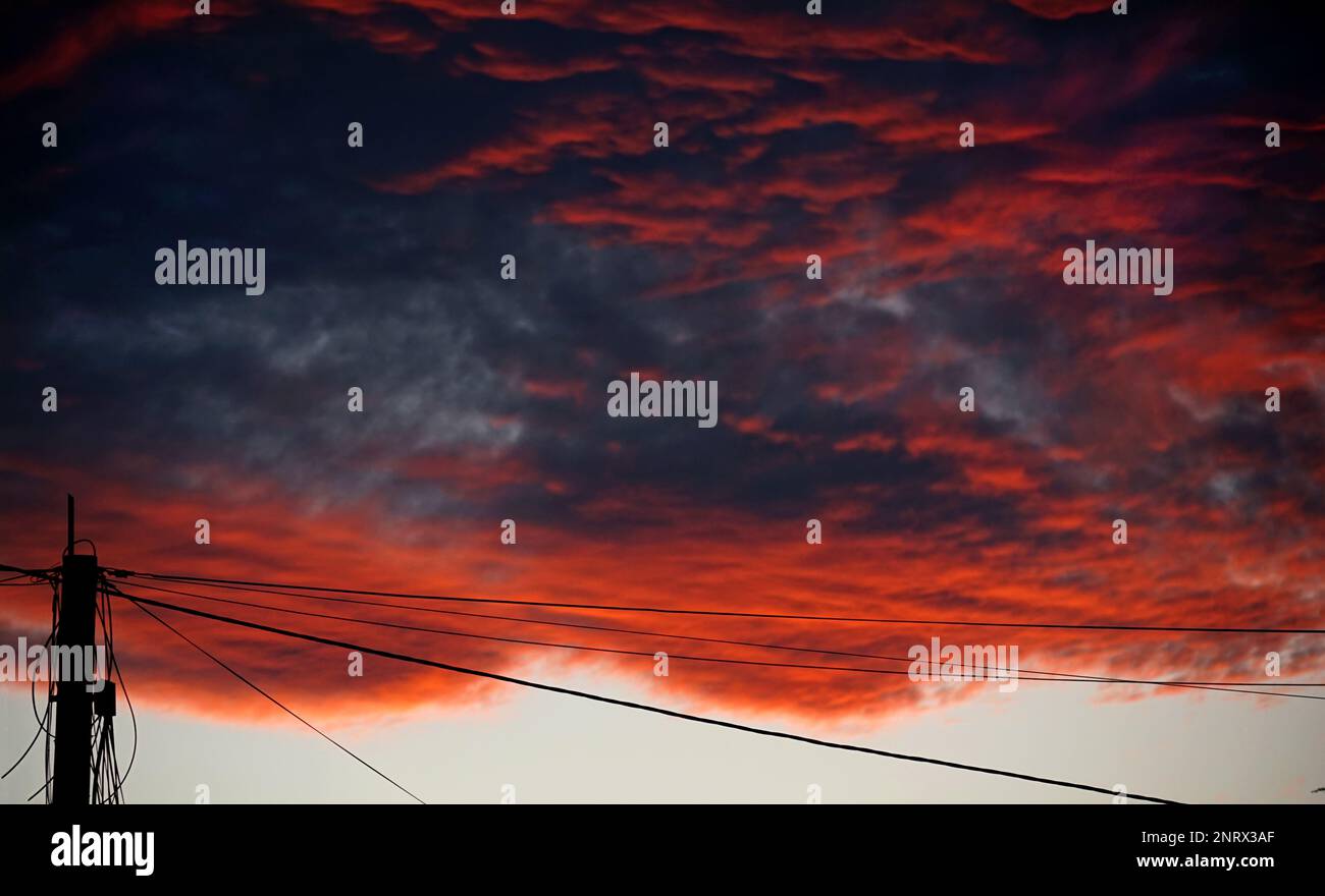 Sunset landscape with dark red clouds Stock Photo - Alamy