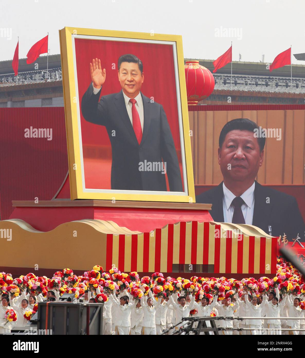 The portrait of China's President Xi Jinping appears during a military ...