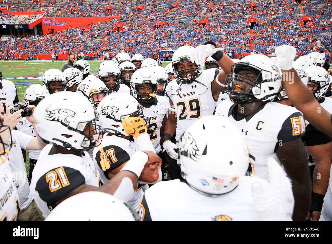 The Towson Tigers huddle before an NCAA college football game against ...