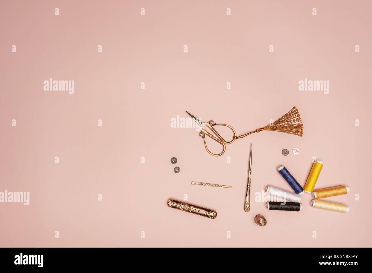 Still life of sewing kits with spools of colored threads, various ...