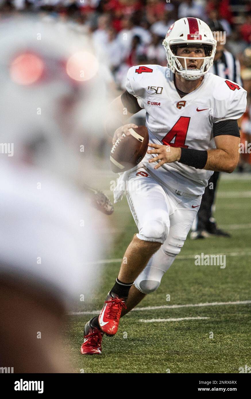 Western Kentucky Hilltoppers quarterback Ty Storey (4) scrambles out of ...