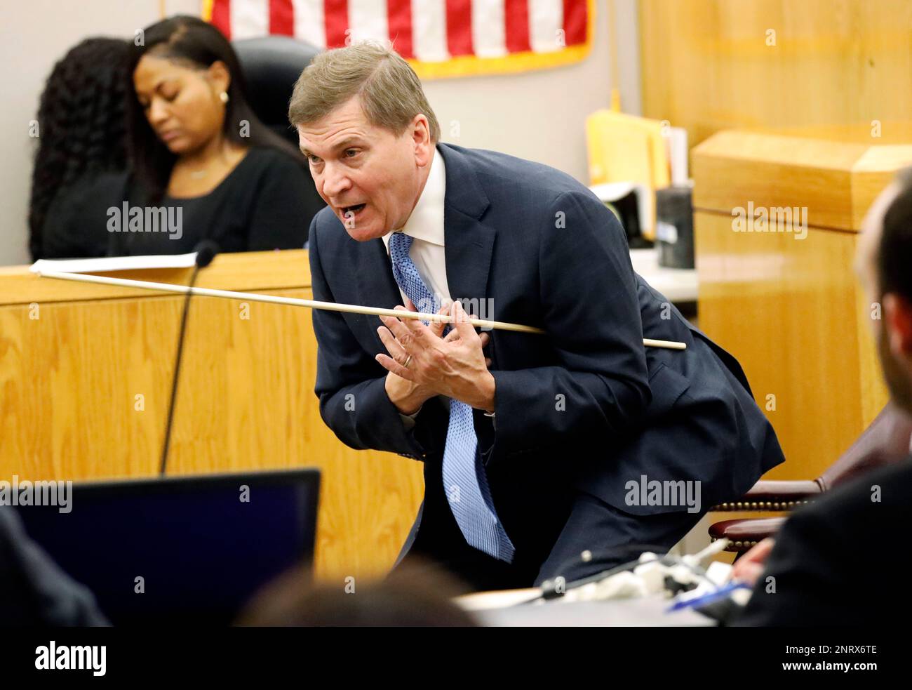 Defense attorney Toby Shook uses a rod to show where Botham Jean was ...