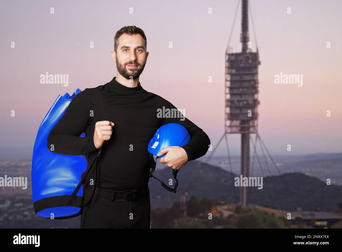 Man, tower worker. Work at height. Radio antenna. With helmet, safety ...