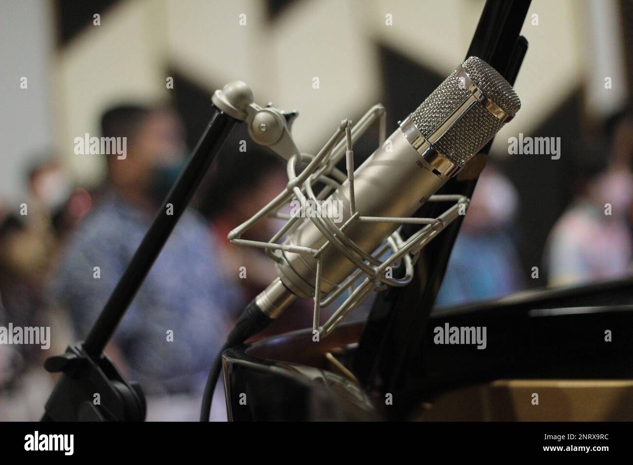 Live performance recording mic with children's background blur Stock ...