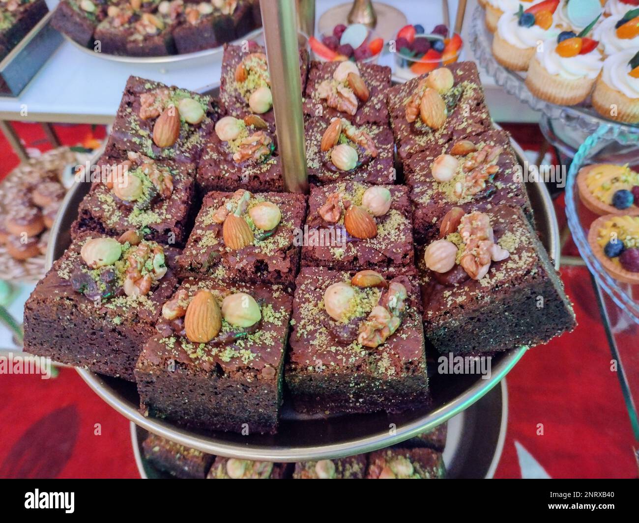 Candy bar with different assortments of cakes Stock Photo - Alamy