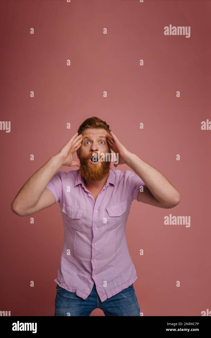 Ginger White Man With Beard Expressing Surprise At Camera Isolated Over