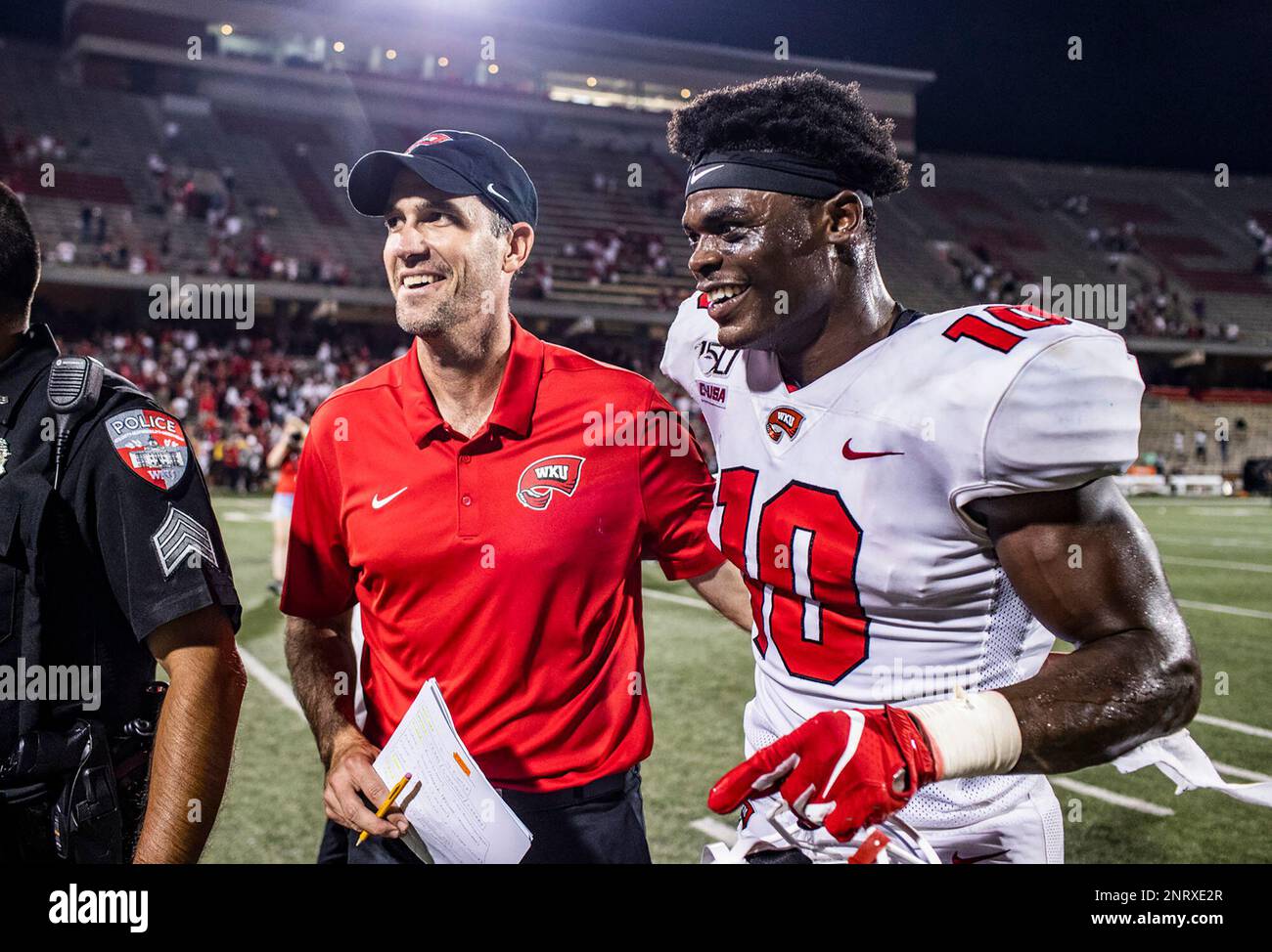 Western Kentucky head coach Tyson Helton and defensive lineman DeAngelo ...
