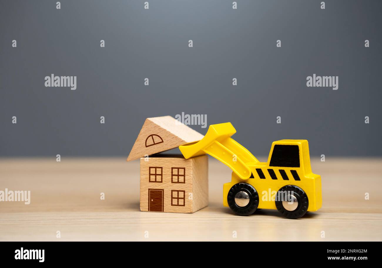 The bulldozer demolishes the house. Encroachment on private property ...