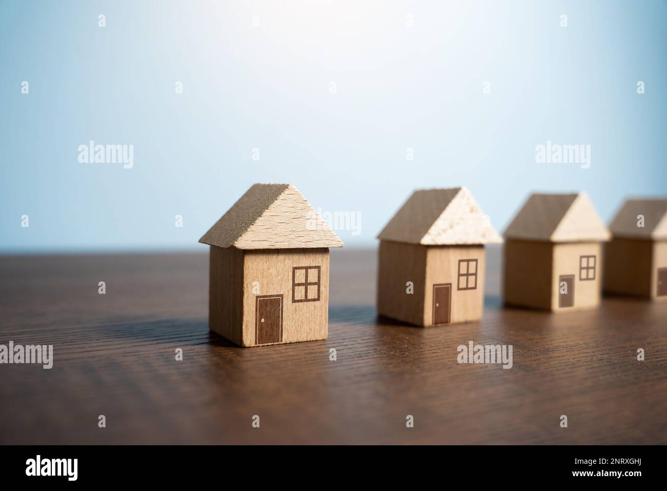 Row of toy houses. Find most suitable housing options. Offers on real ...