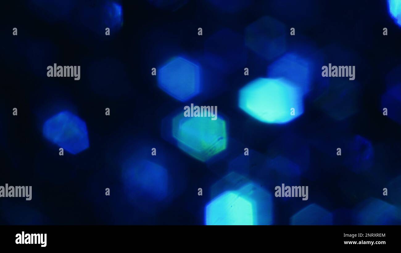 Animated abstract background and fading blue particles designed as a background, texture or ...