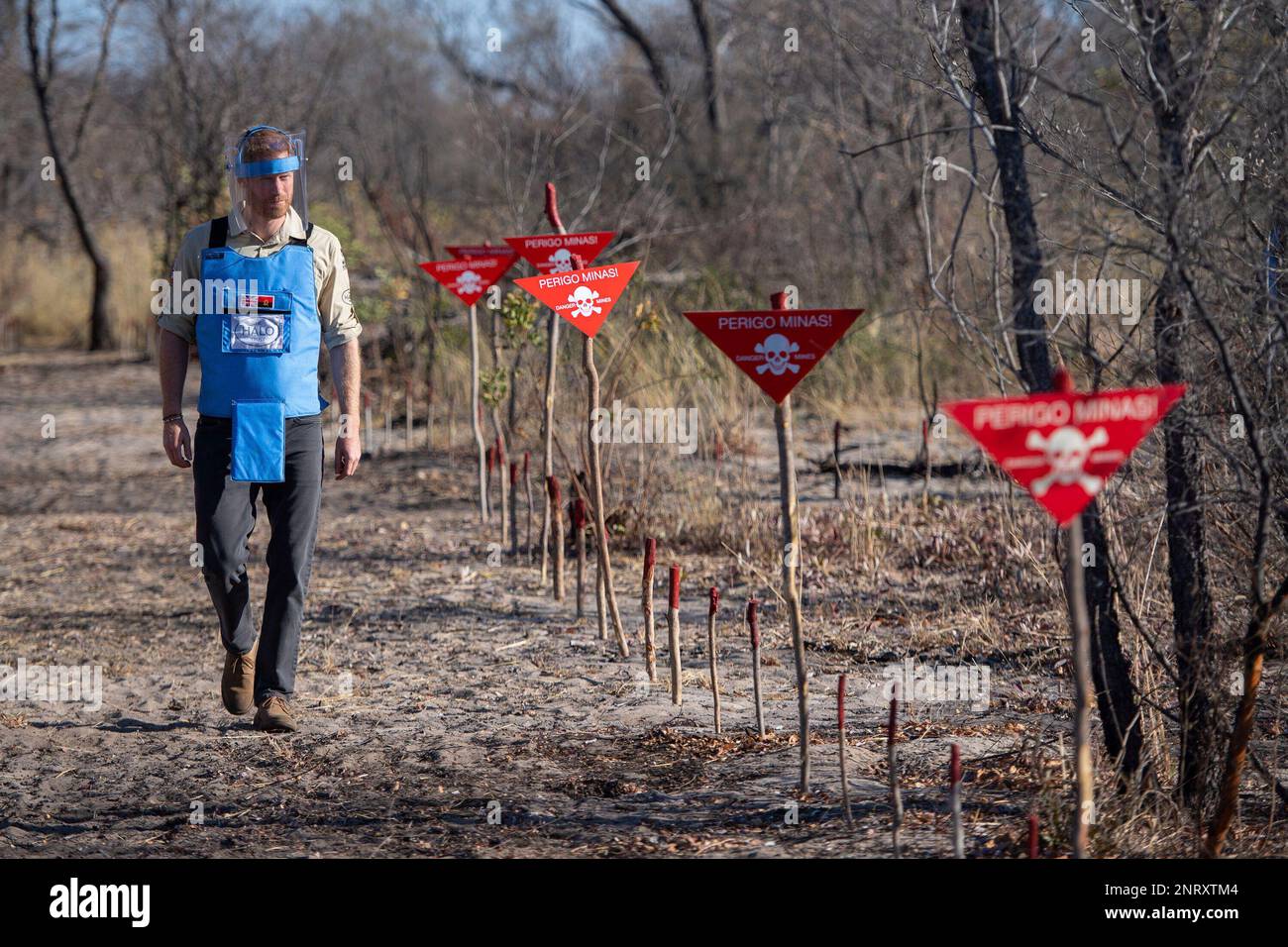 Britain's Prince Harry walks through a minefield in Dirico, Angola ...