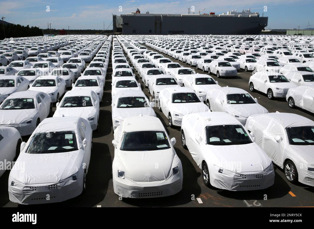 The Volkswagen Beetle and other vehicles are unloaded at the Toyohashi ...