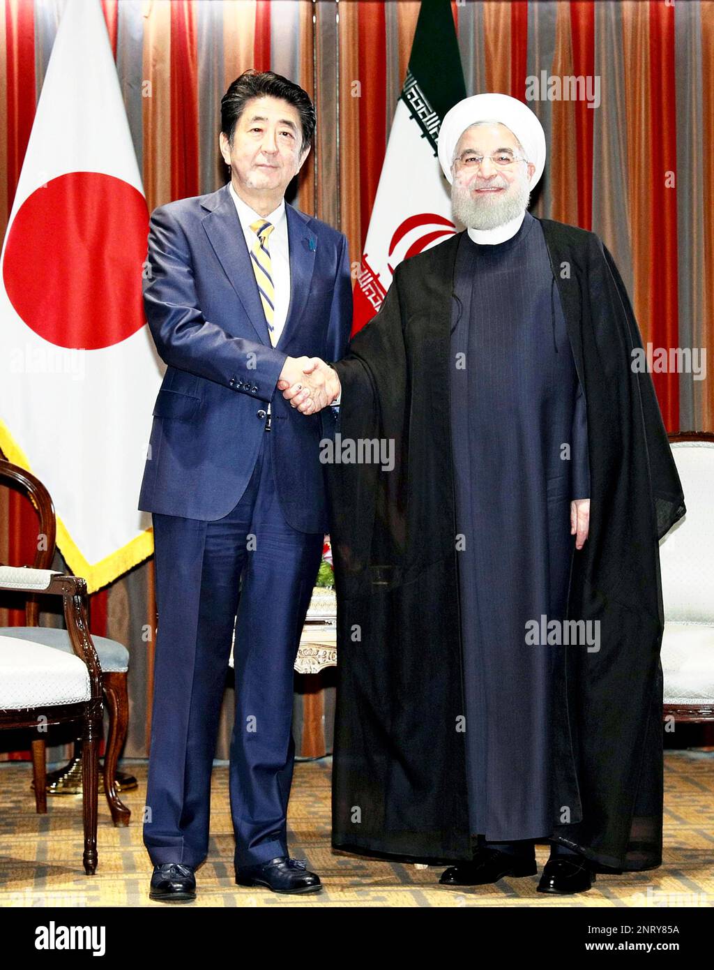 Japanese Prime Minister Shinzo Abe (L) and Iranian President Hassan ...