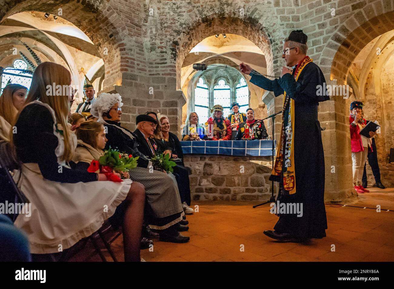 The fake priest is seen blessing the couple and their relatives. The ...