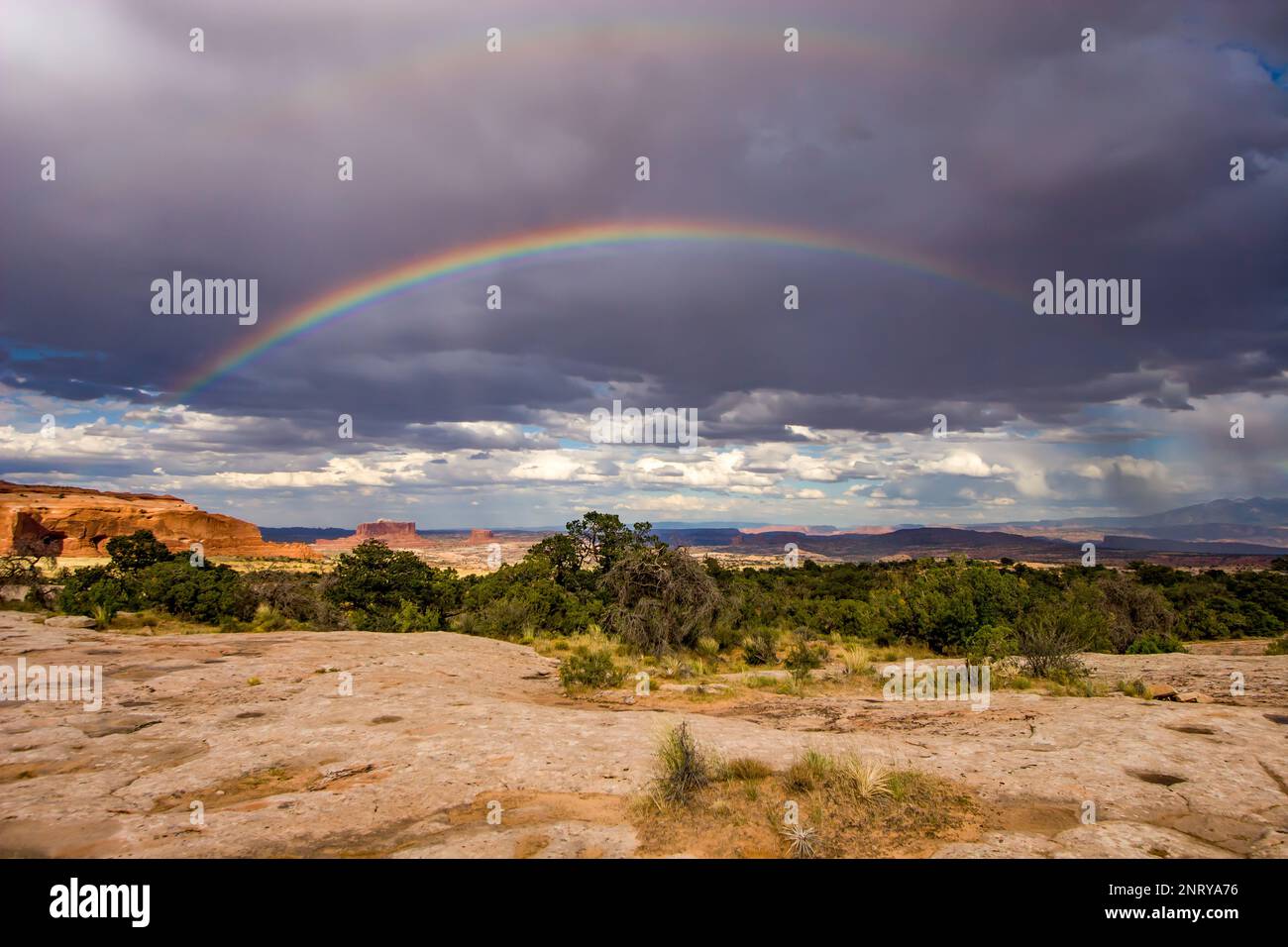 Rainbow over Merrimac Butte, Monitor Butte and Arth's Pasture. Moab ...