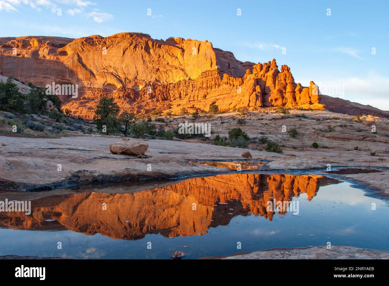 The Entrada sandstone formations of the Navajo Rocks reflected in a ...