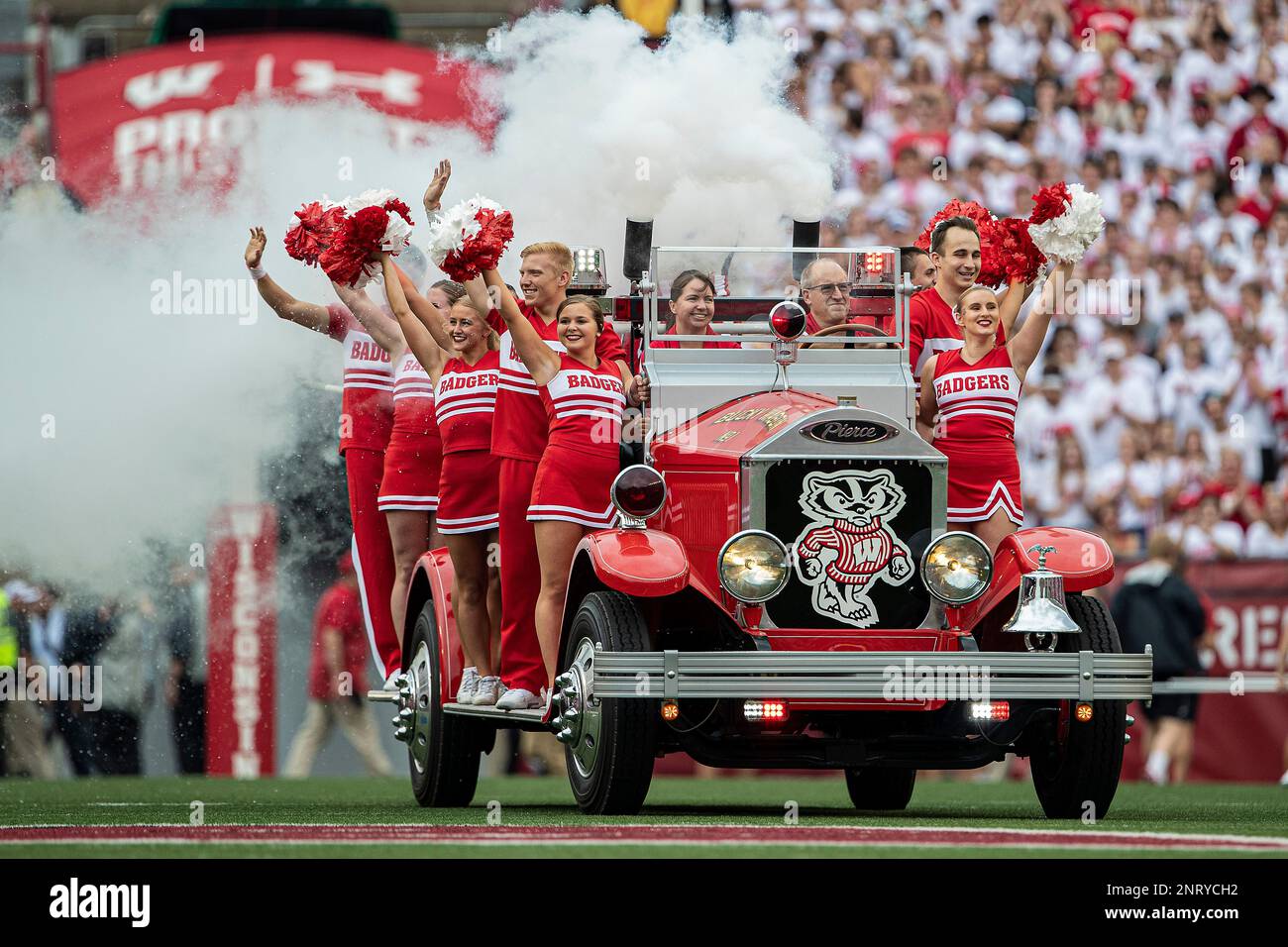 MADISON, WI - SEPTEMBER 21: Wisconsin Badger cheerleaders ride out onto ...