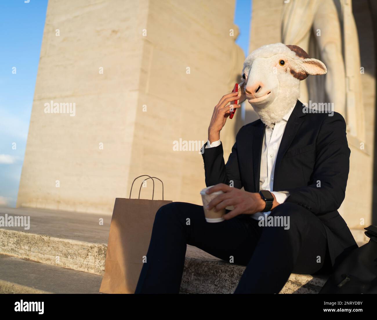 business with sheep head sitting talking on the phone in his lunch ...