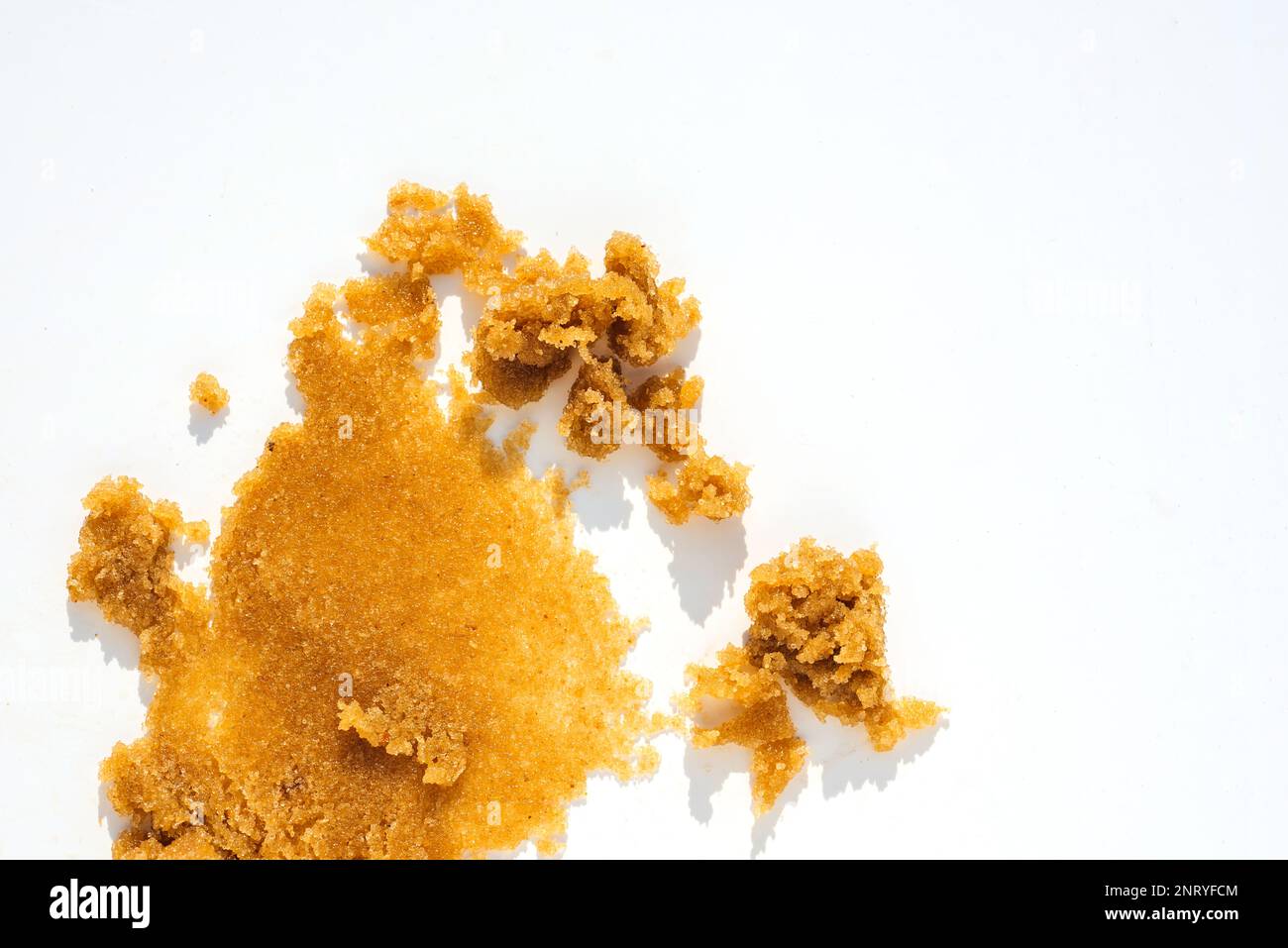 Abstract background with texture of scrub crystals with sugar and honey ...