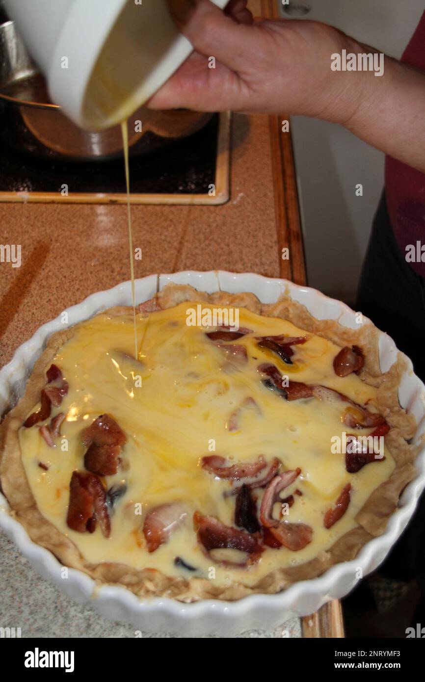 Pouring Savoury Custard on Quiche Lorraine Stock Photo - Alamy