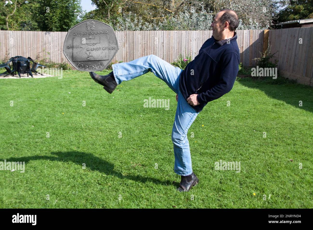 Football Crazy with person balancing fifty pence on foot Stock Photo ...