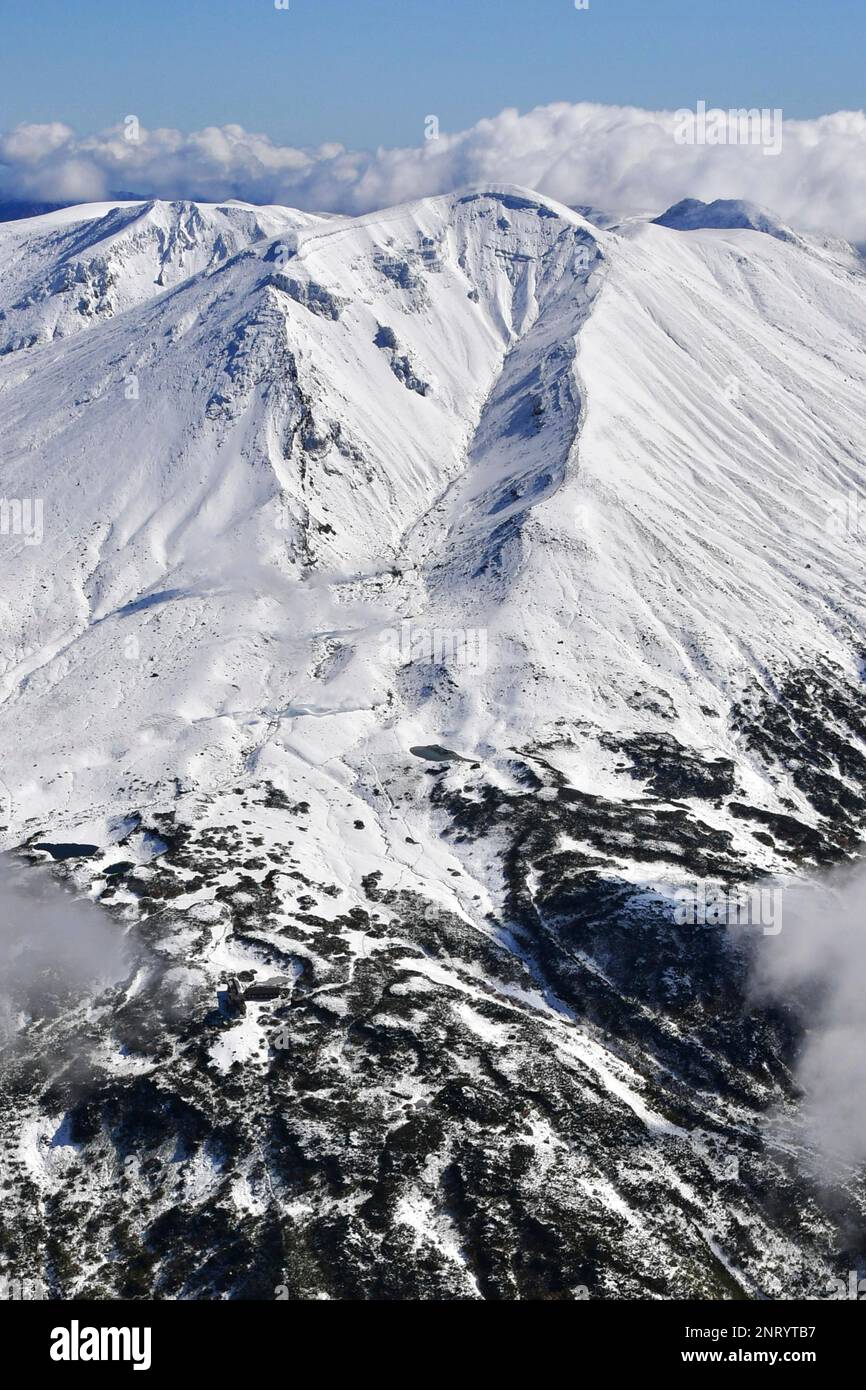 An aerial photo shows Asahidake, Mount Asahi, covered with snow in ...