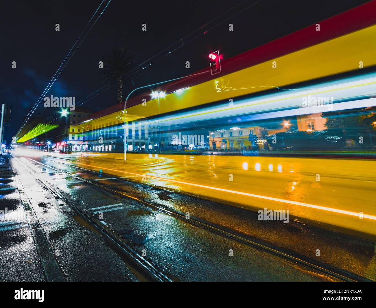 light trails of tram in the city at night Stock Photo - Alamy