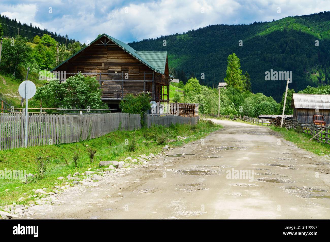 A traditional wooden hut shelter under the foot of the Carpathians ...