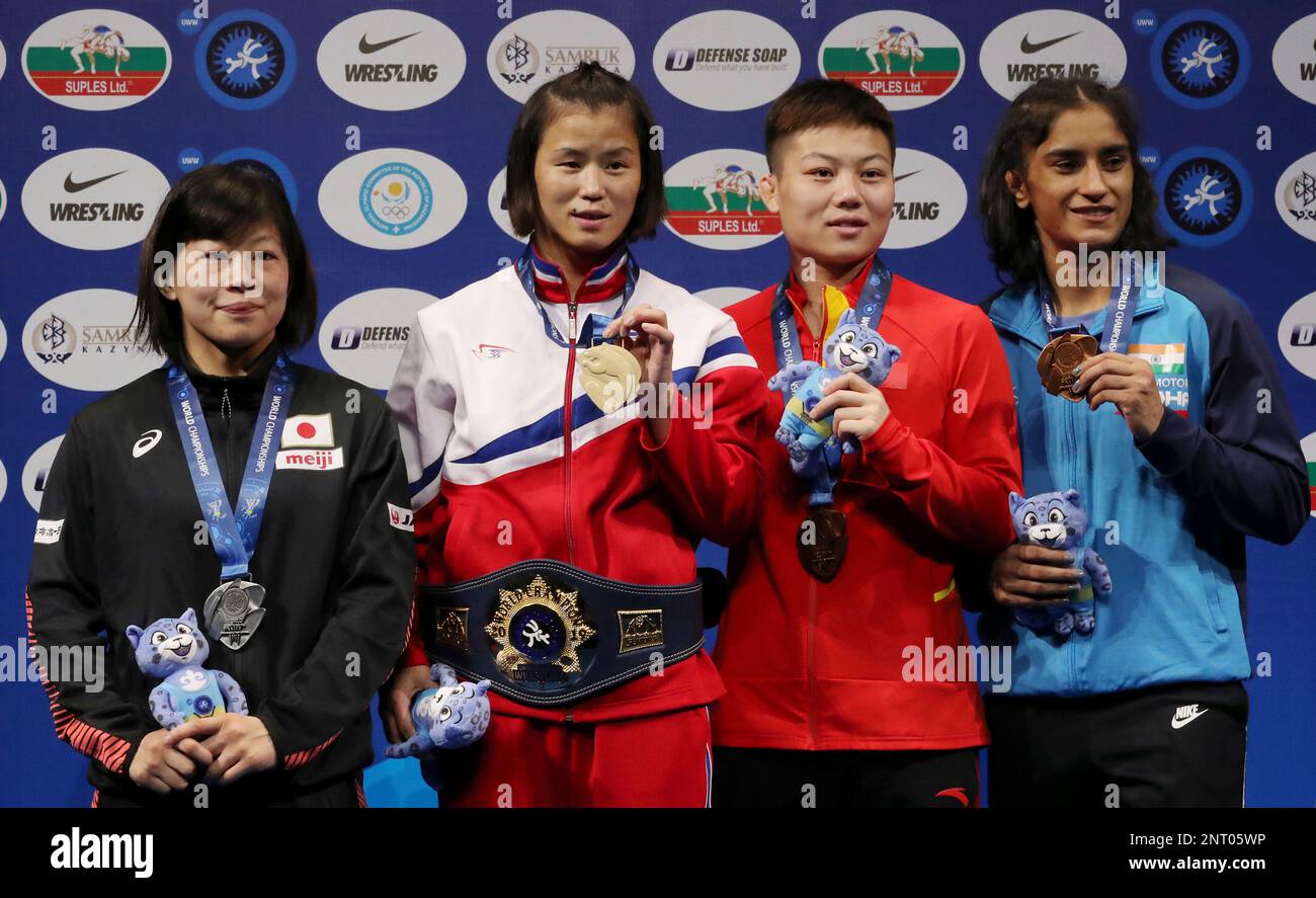 Yong Mi PAK (2nd from L) of North Korea (blue) celebrates during an ...