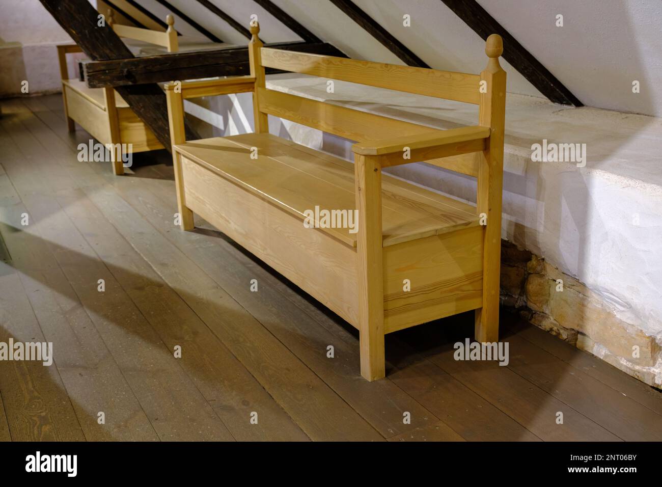 Waiting room. A large, wide, lacquered wooden bench in the exhibition ...