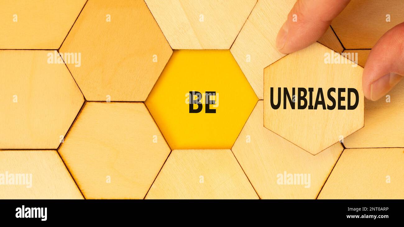 Be unbiased symbol. Concept words Be unbiased on wooden puzzles ...