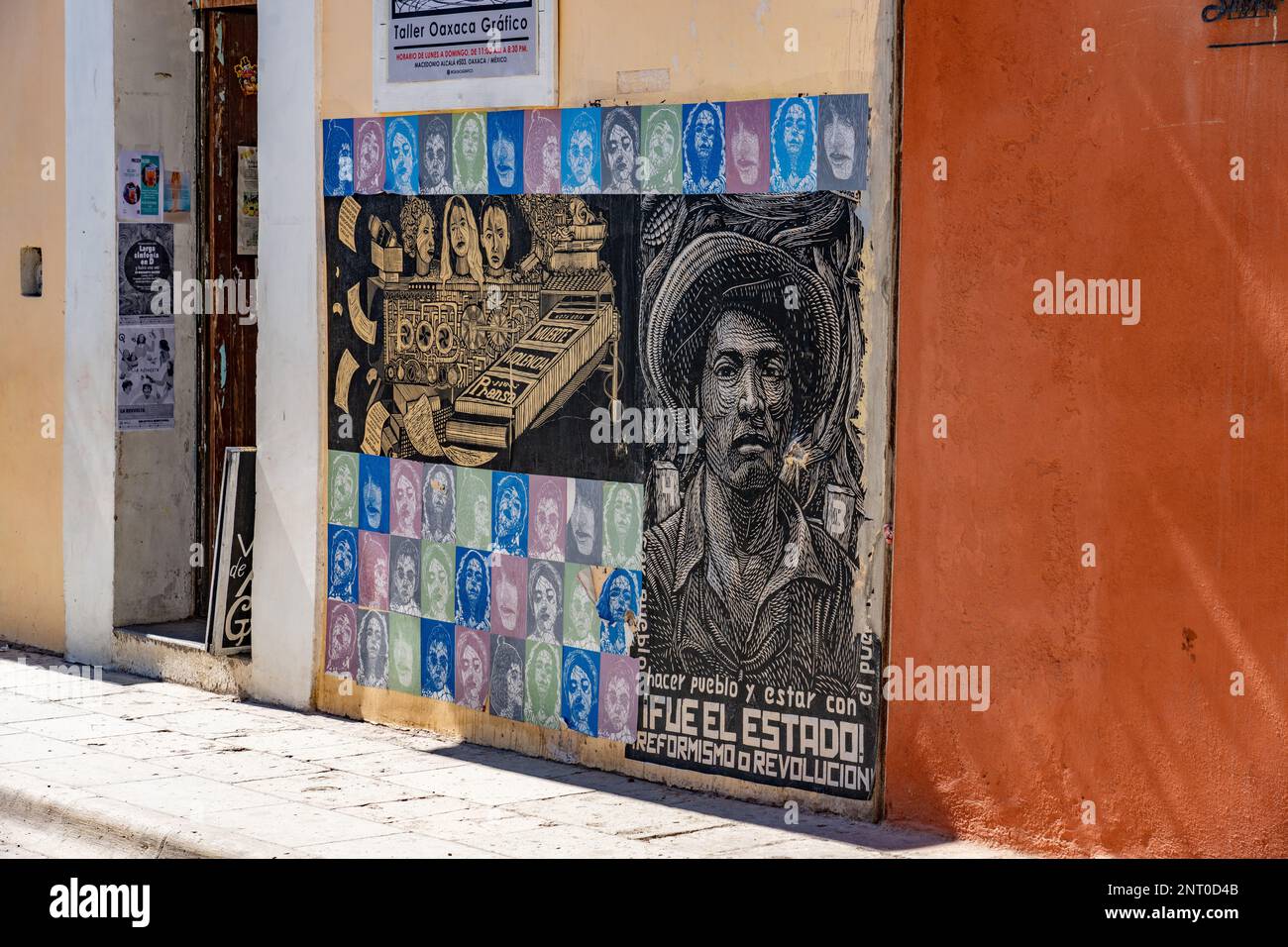 Political protest posters on a wall in the historic city of Oaxaca ...