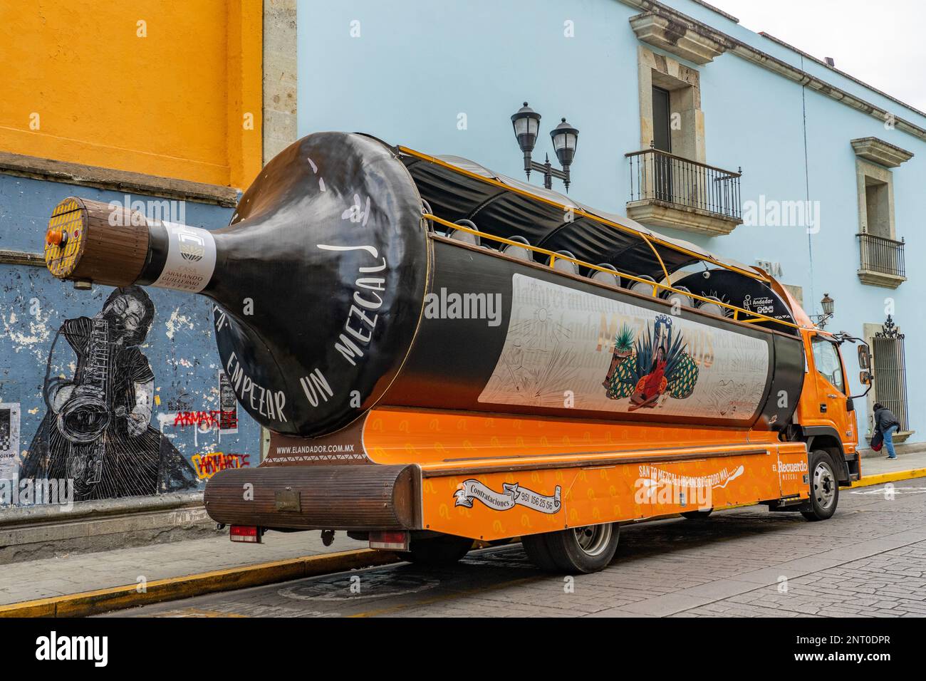 A unique customized tour bus in the shape of a mezcal bottle on the ...