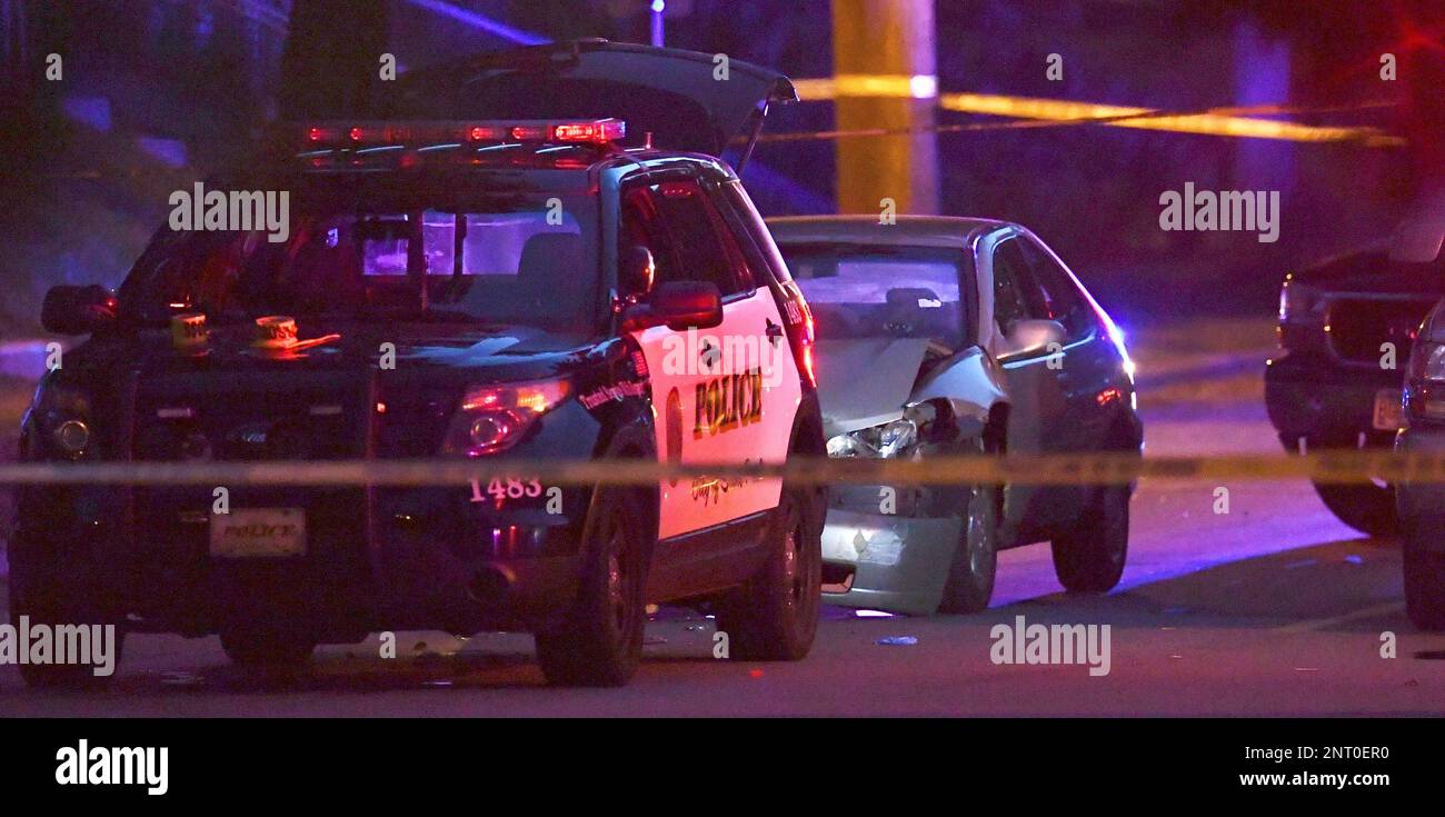 A car with front end damage is stopped behind a St. Paul police cruiser ...
