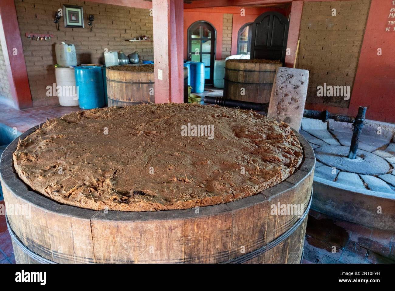A wooden fermentation vat at a small mezcal distillery in Santiago ...