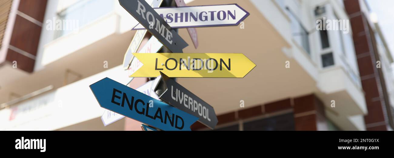 Pillar sign with pointers of different cities and countries Stock Photo ...