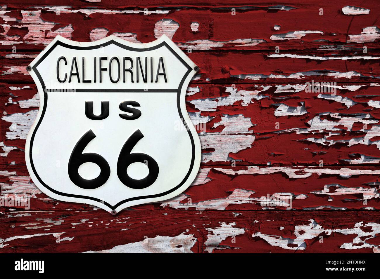 Close-up on an California US 66 route sign screwed on a wooden wall ...
